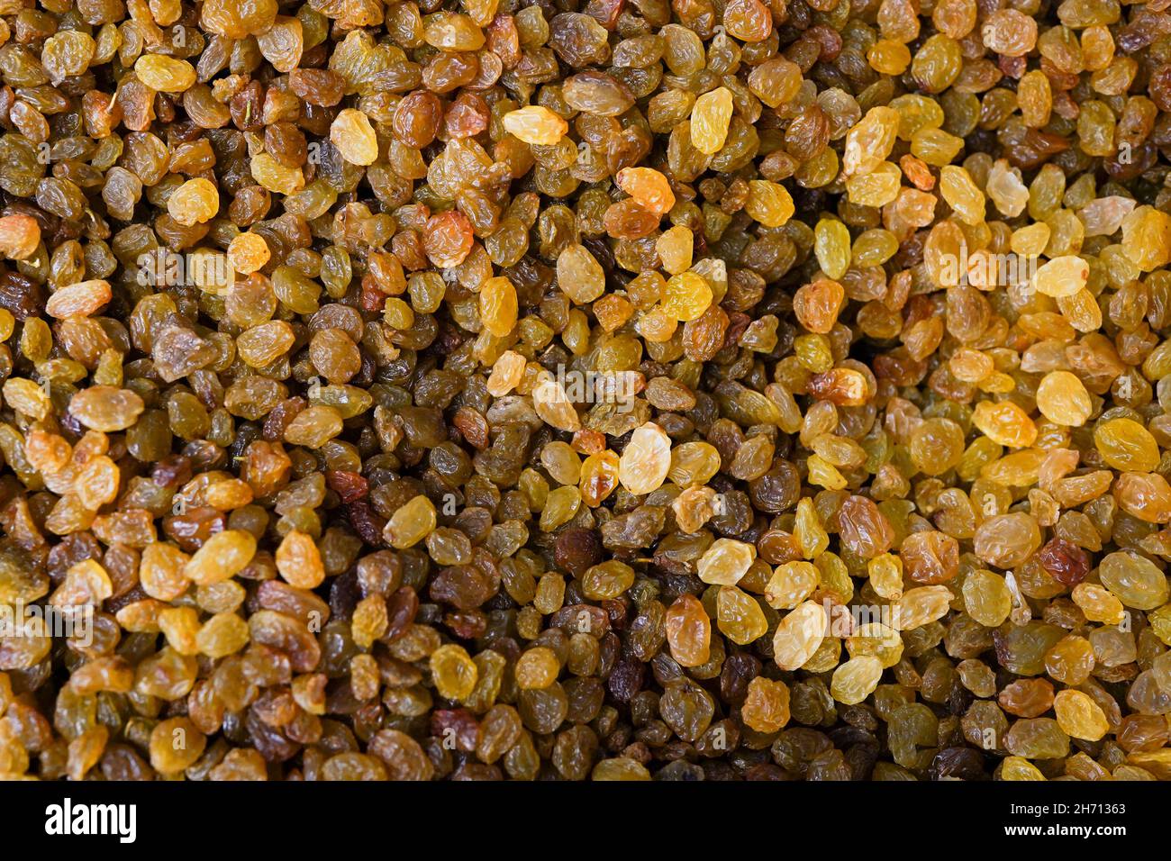 yellow and orange Raisins as an abstract background texture Stock Photo ...