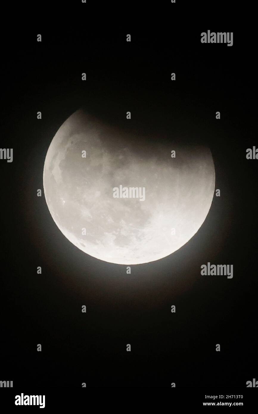 Tokyo, Japan. 19th Nov, 2021. A partial lunar eclipse is seen from ...
