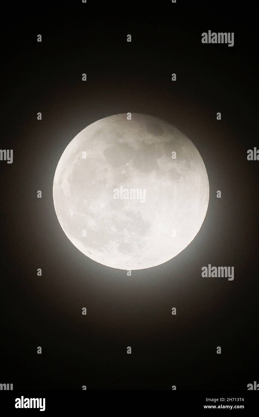 Tokyo, Japan. 19th Nov, 2021. A partial lunar eclipse is seen from ...
