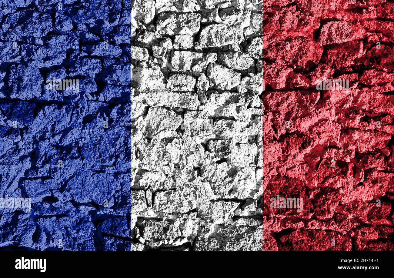 France flag depicted on a stone wall. The texture of the stone blends ...