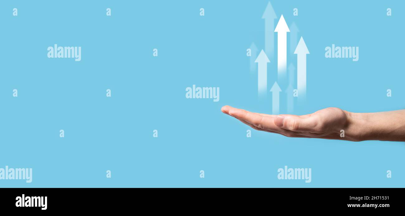 Businessman hold sales data and economic growth graph chart. Business ...