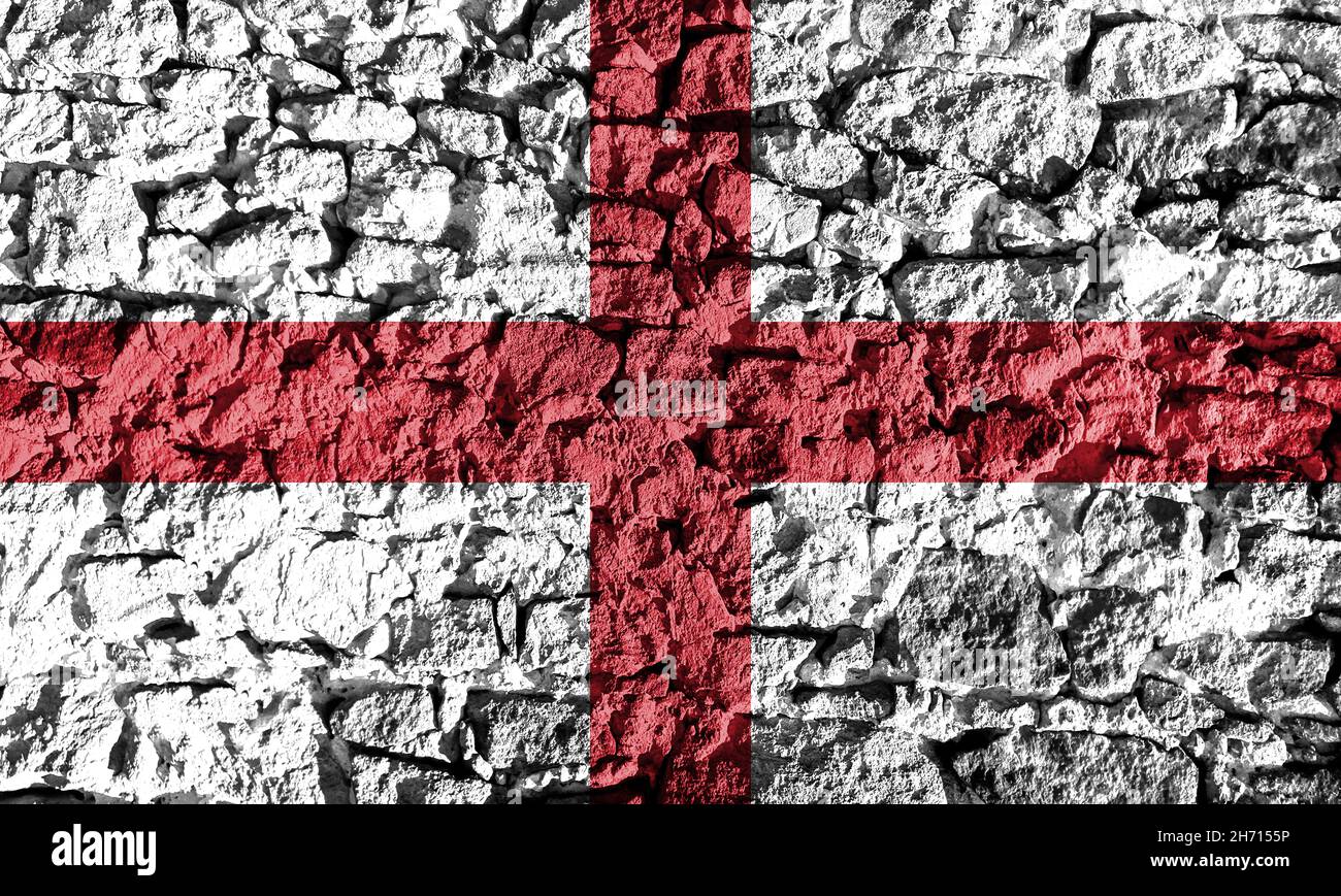 England flag depicted on a stone wall. The texture of the stone blends ...