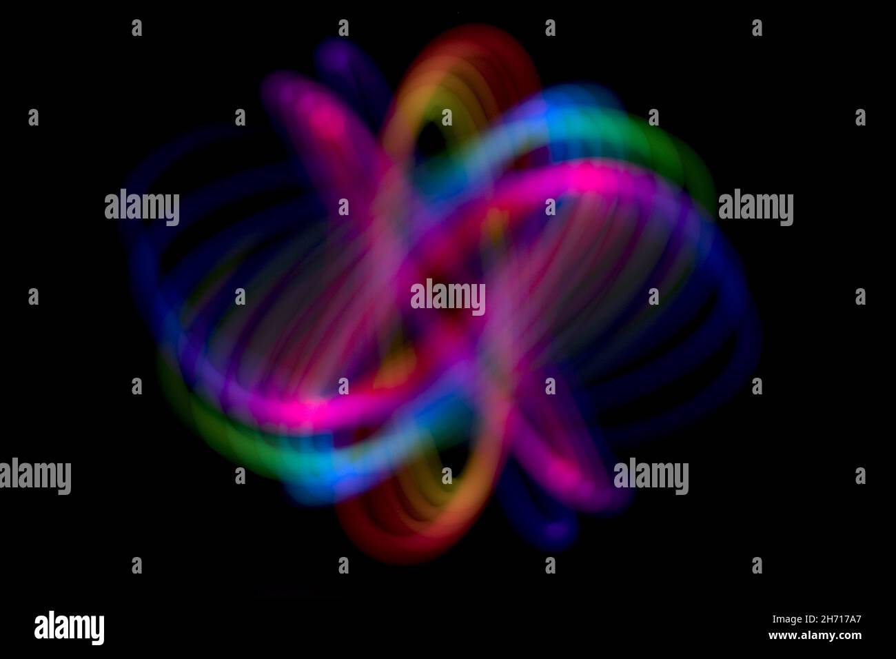 Abstract rainbow path of moving LED light on black backgroung Stock ...