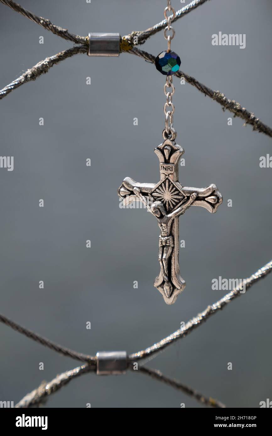 Metal Cross with the crucified Jesus on a gray background Stock Photo ...