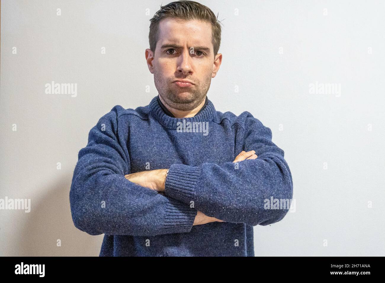 Closeup of the man in a blue sweater isolated on white background Stock ...
