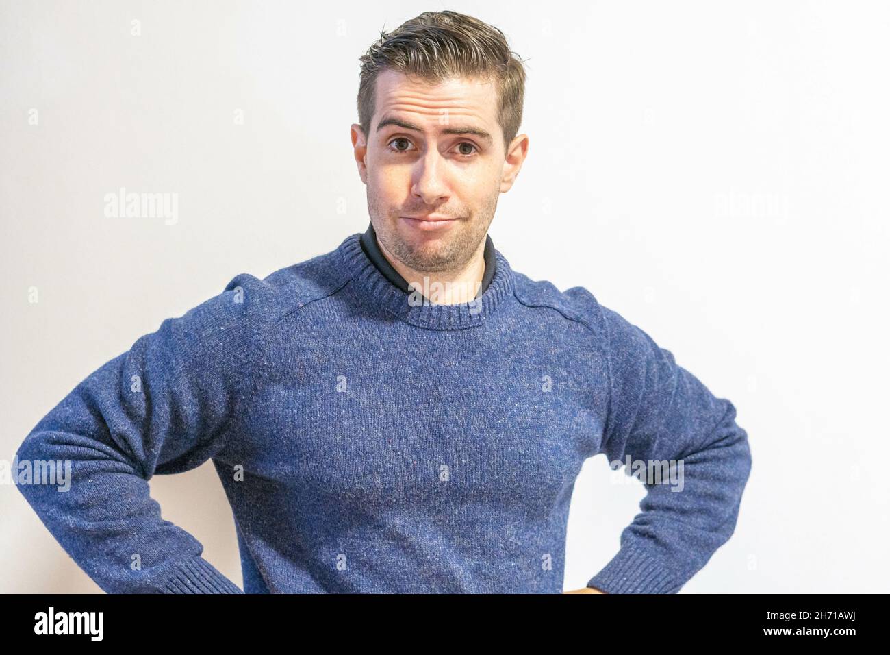 Closeup of the man in a blue sweater isolated on white background Stock ...