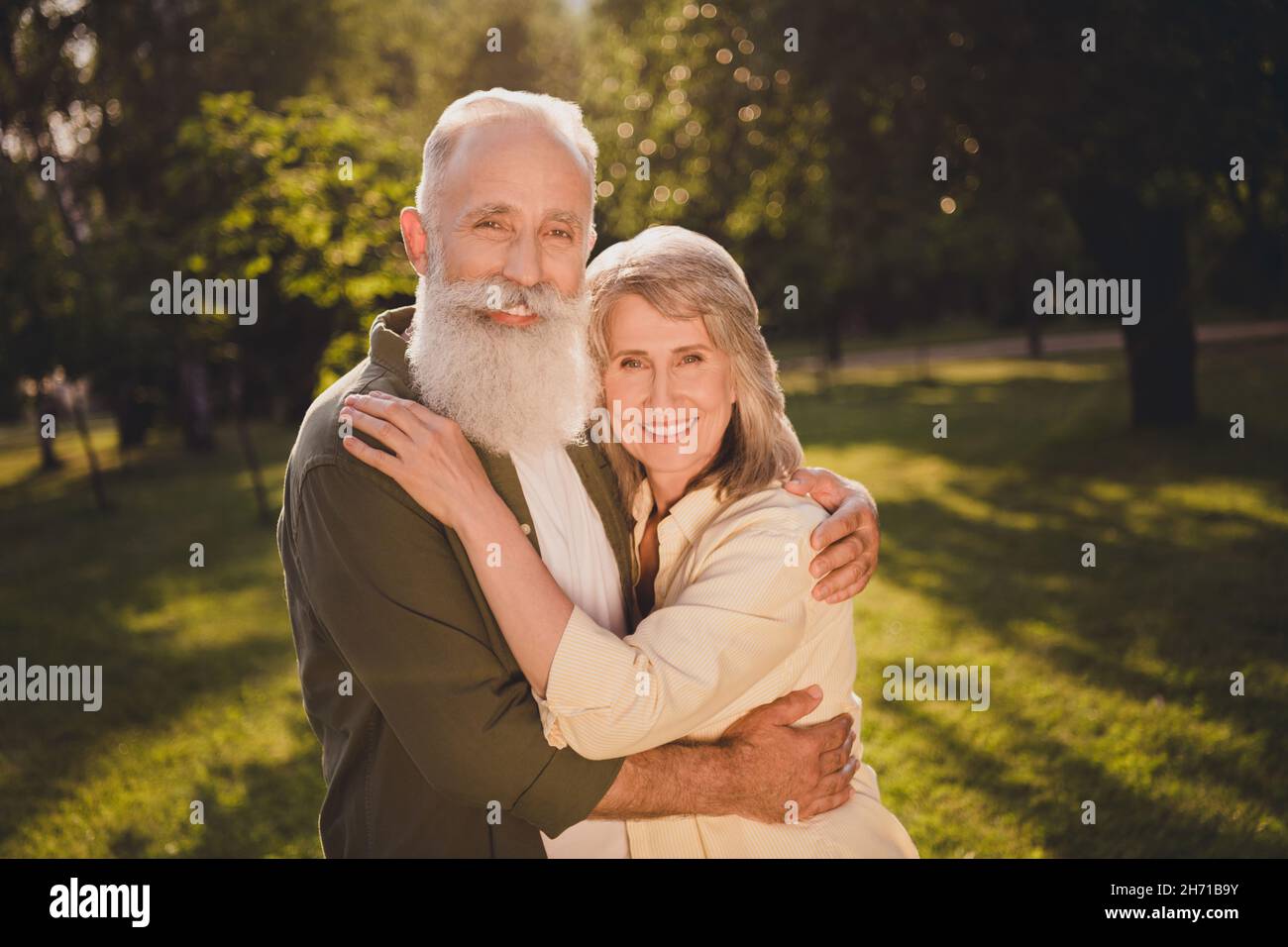 Photo of friendly emotion pensioner white hair couple hug wear trend ...