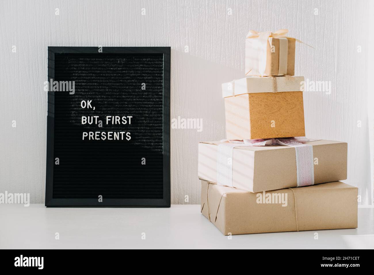 Many craft Christmas gift boxes and black letter board with quote Ok ...