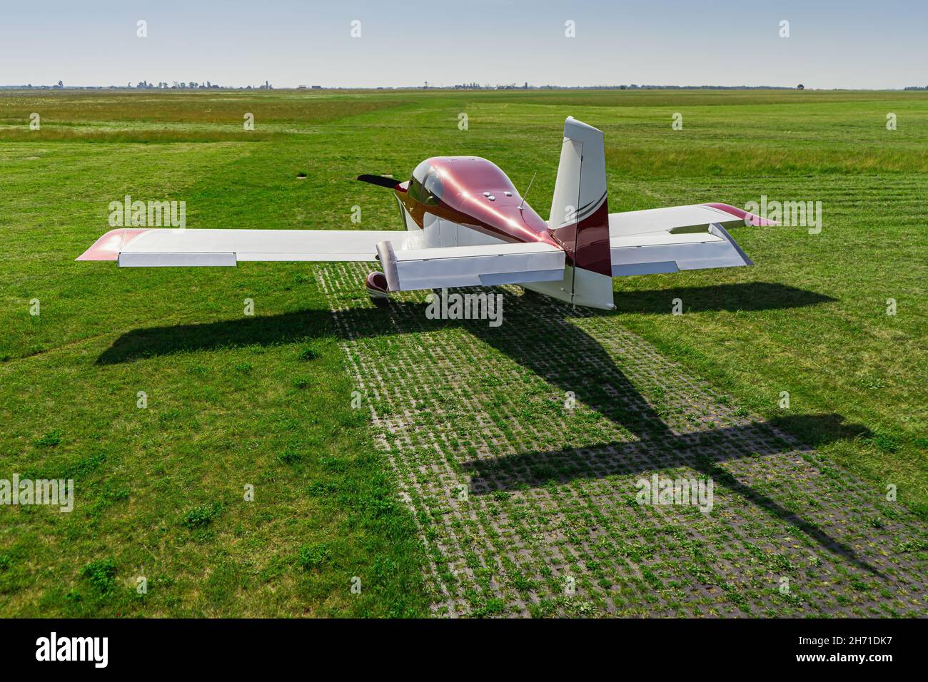 Small modern private jet before the flight against the backdrop of ...