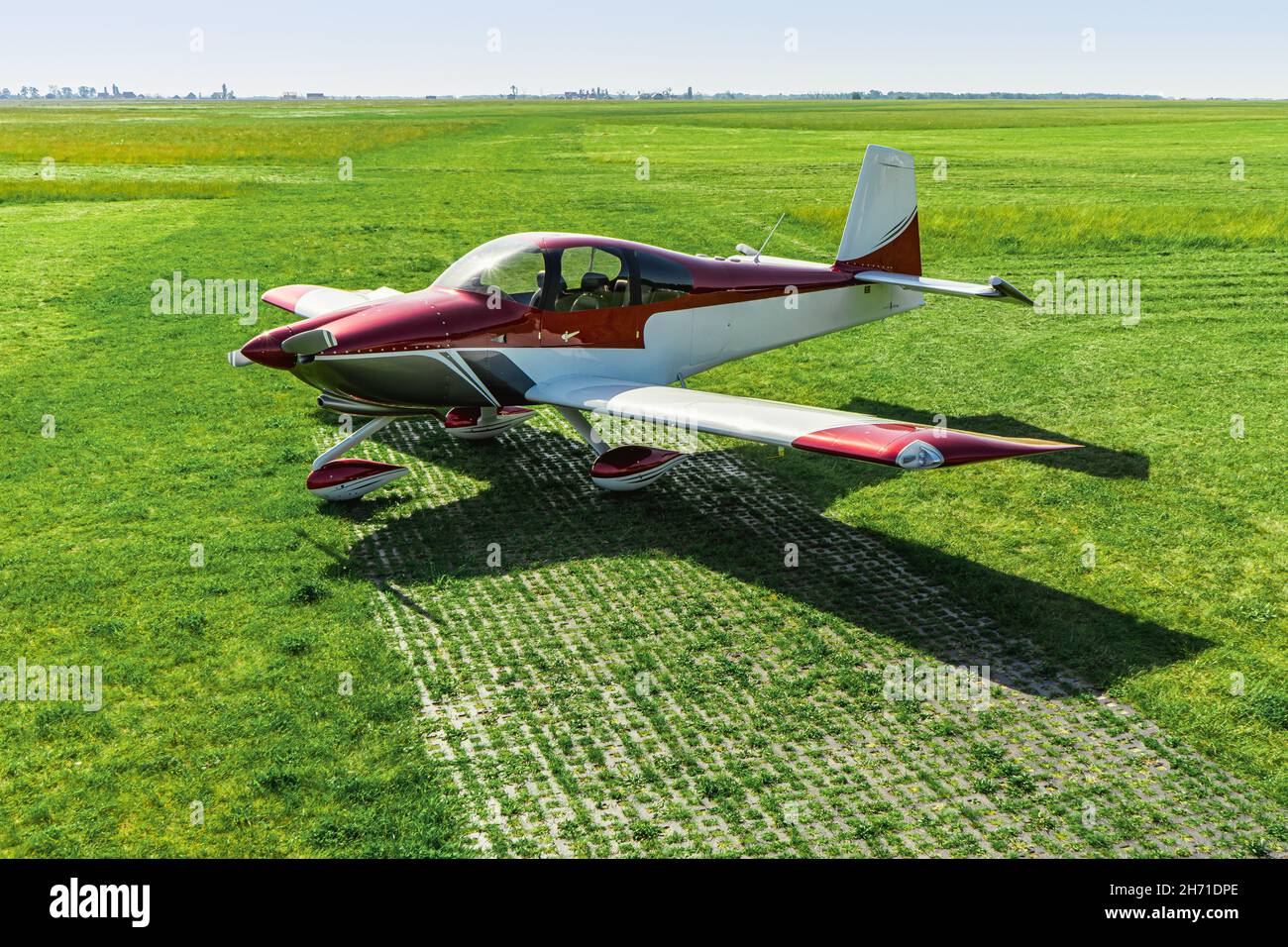 Small modern private jet before the flight against the backdrop of ...