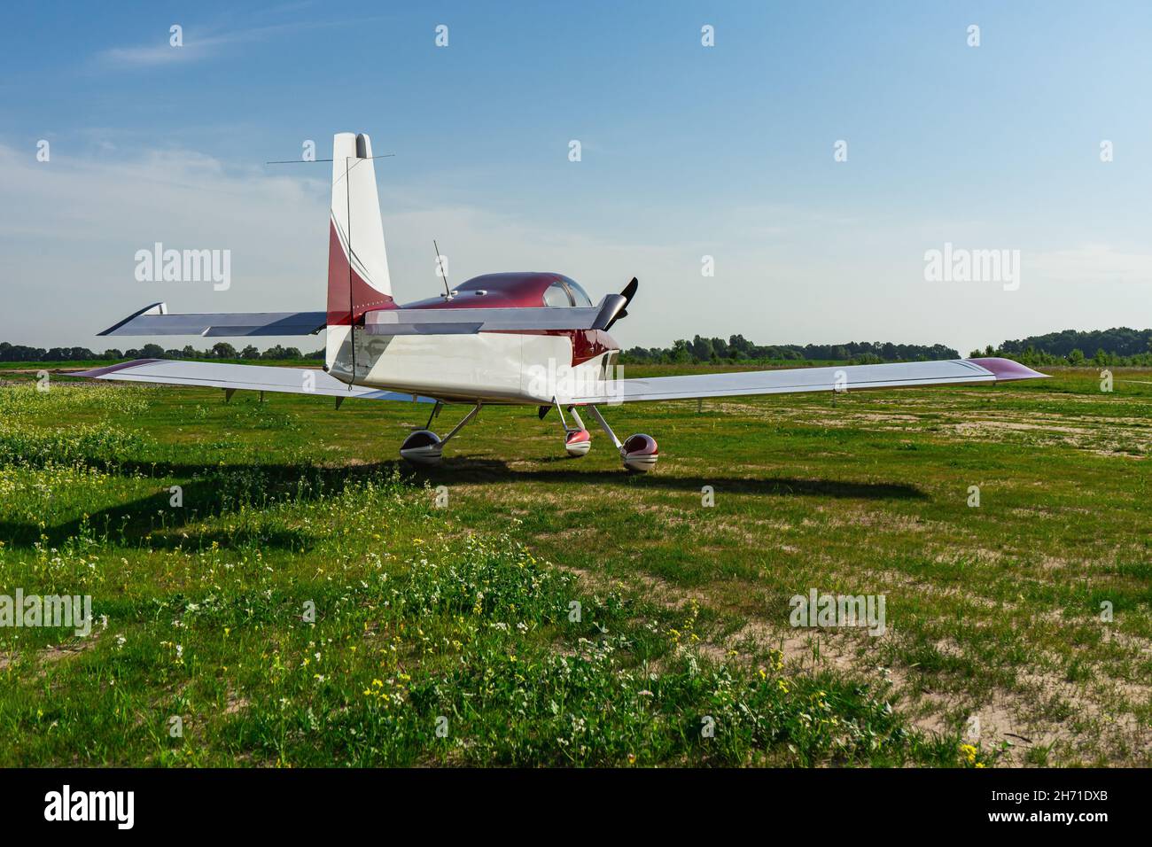 Small modern private jet before the flight against the backdrop of ...