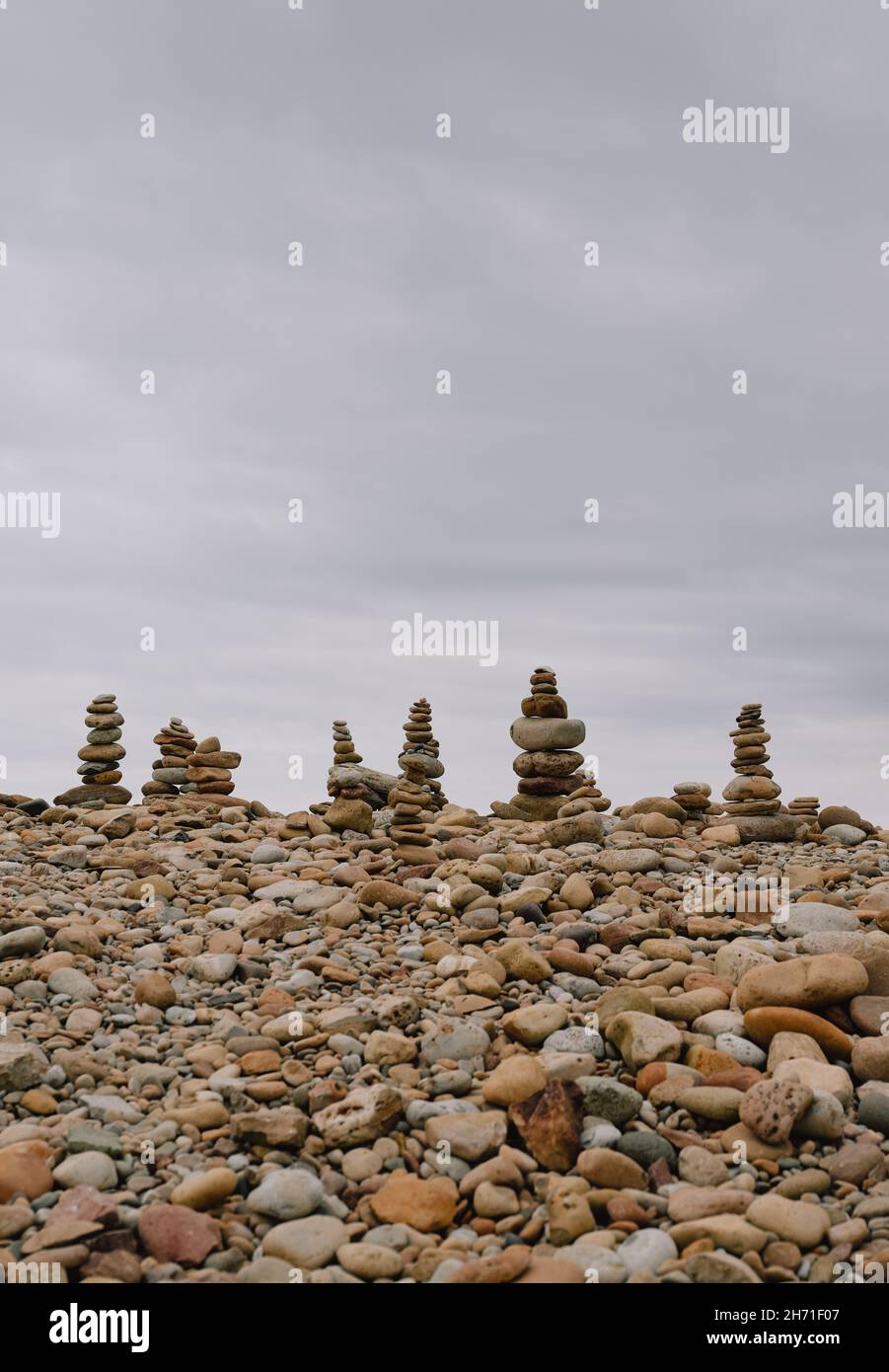 Stone pebble tourist cairns - man-made balanced piles (or stack) of ...