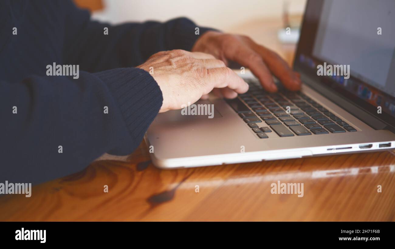 Old hands on the keyboard. Retired person learn to use computer Stock ...