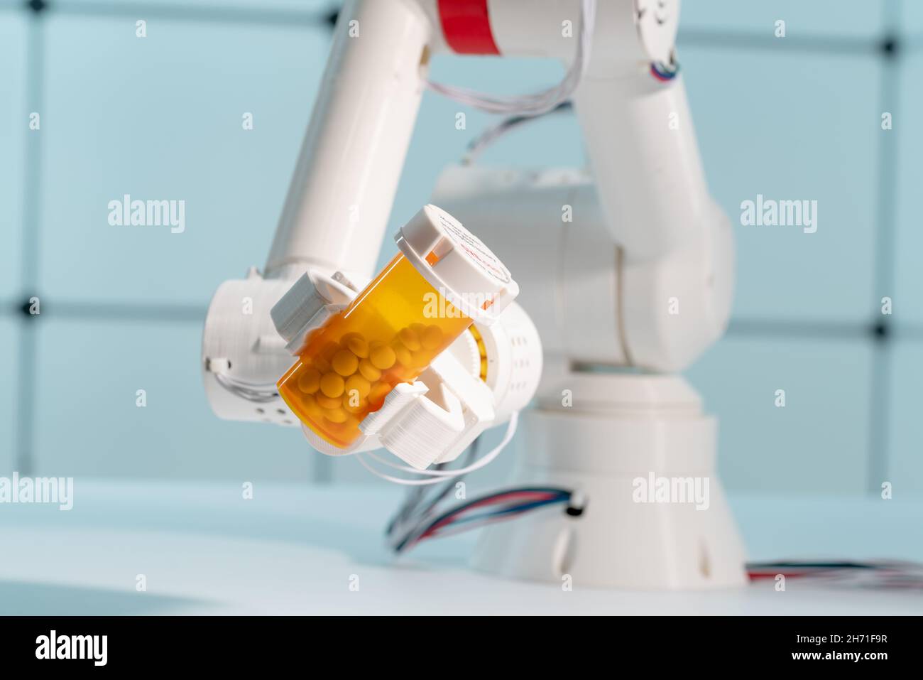 Robot arm with a pills tablets in bottle in the laboratory Stock Photo ...