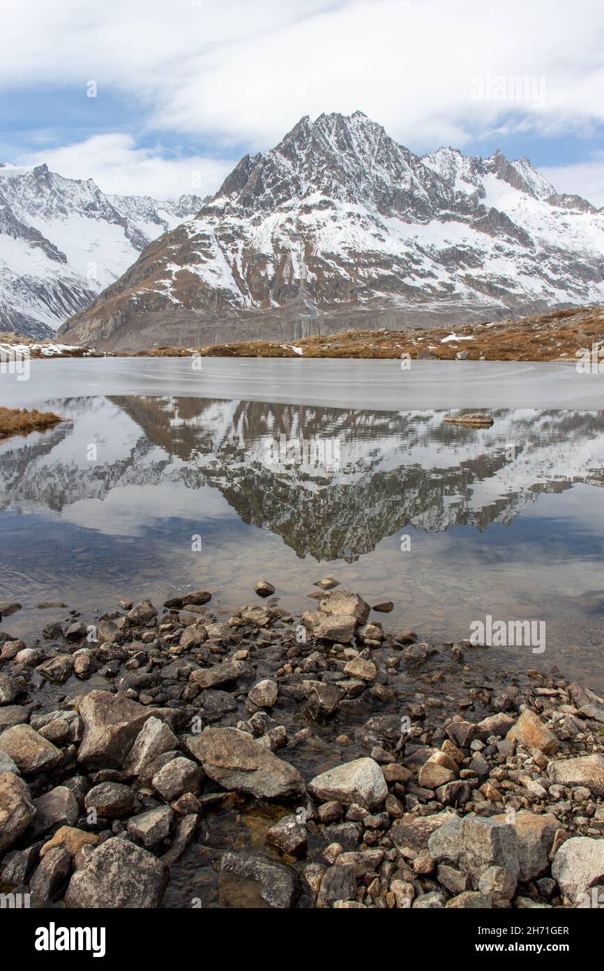 Vertical shot of snowy mountains. Jungfrau region, Bernese Oberland ...
