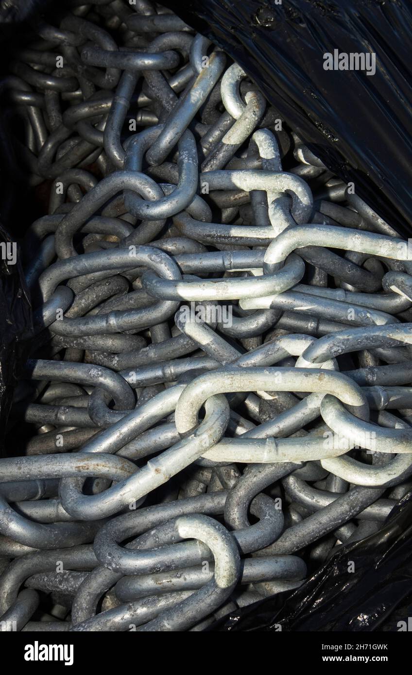 New galvanised chain links wait to be used on fishing lines for boats ...