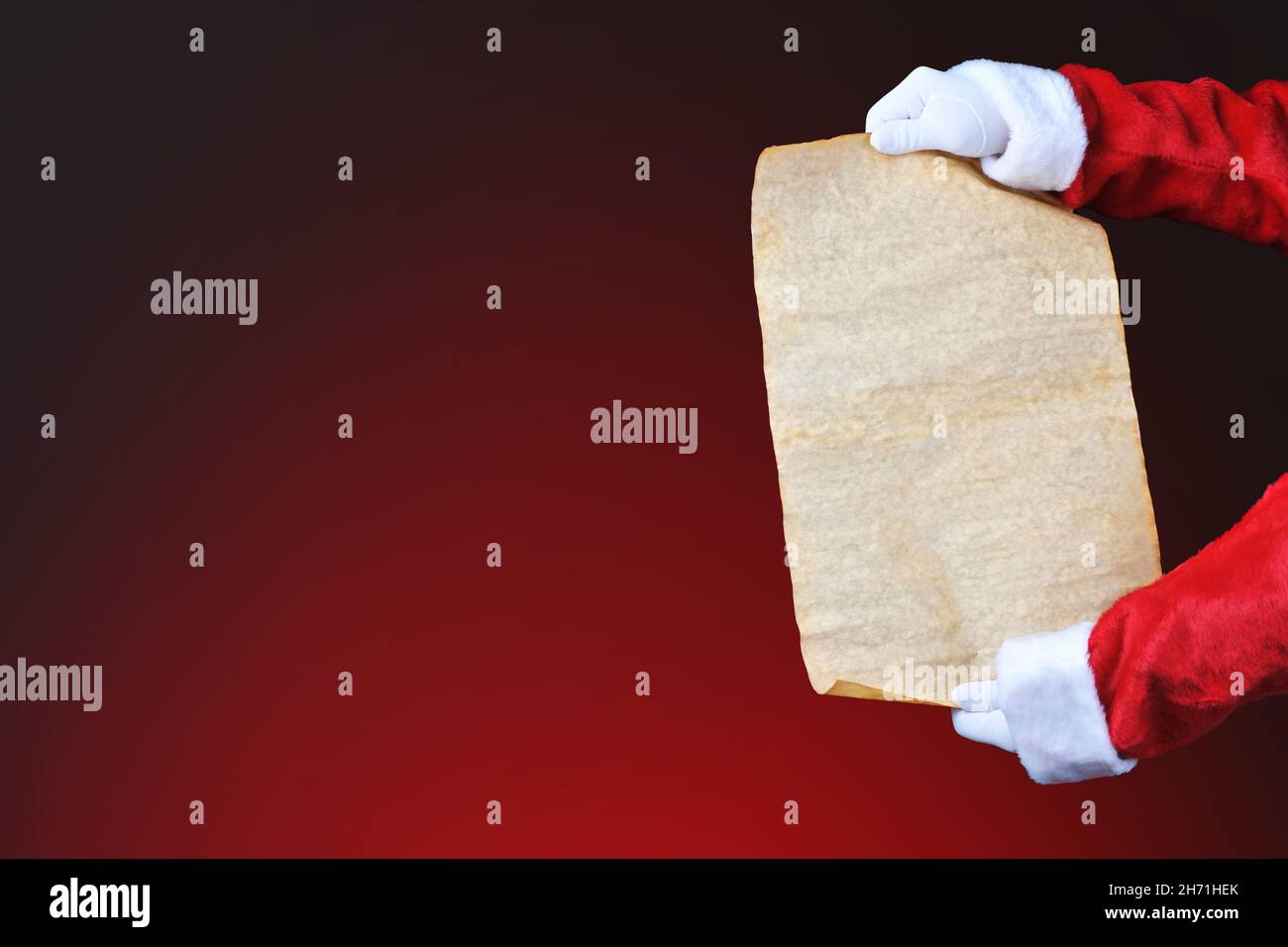 Santa Claus holding a blank scroll - Naughty and Nice List over a red ...
