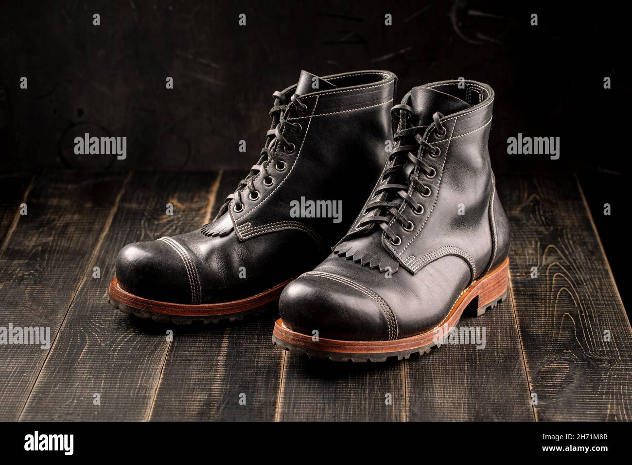 Hand crafted black leather high boots Stock Photo - Alamy