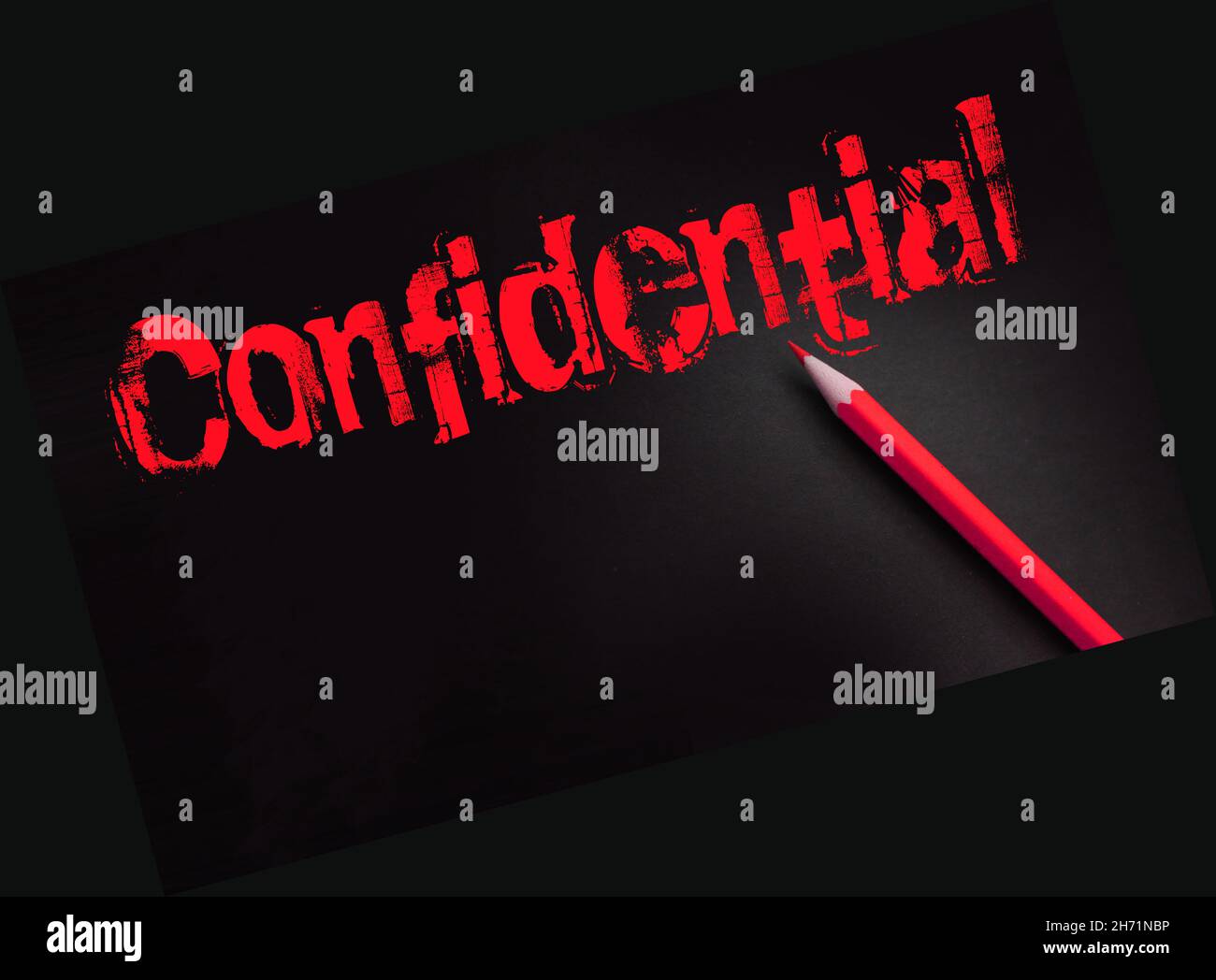 The word confidential yellow on black and a pencil besides. Secret ...