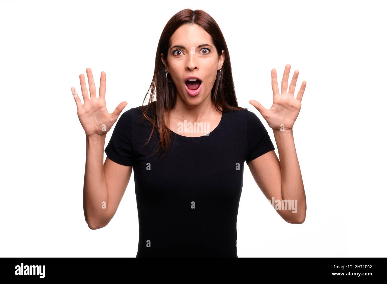 Isolated in white background brunette woman saying surprise in spanish ...