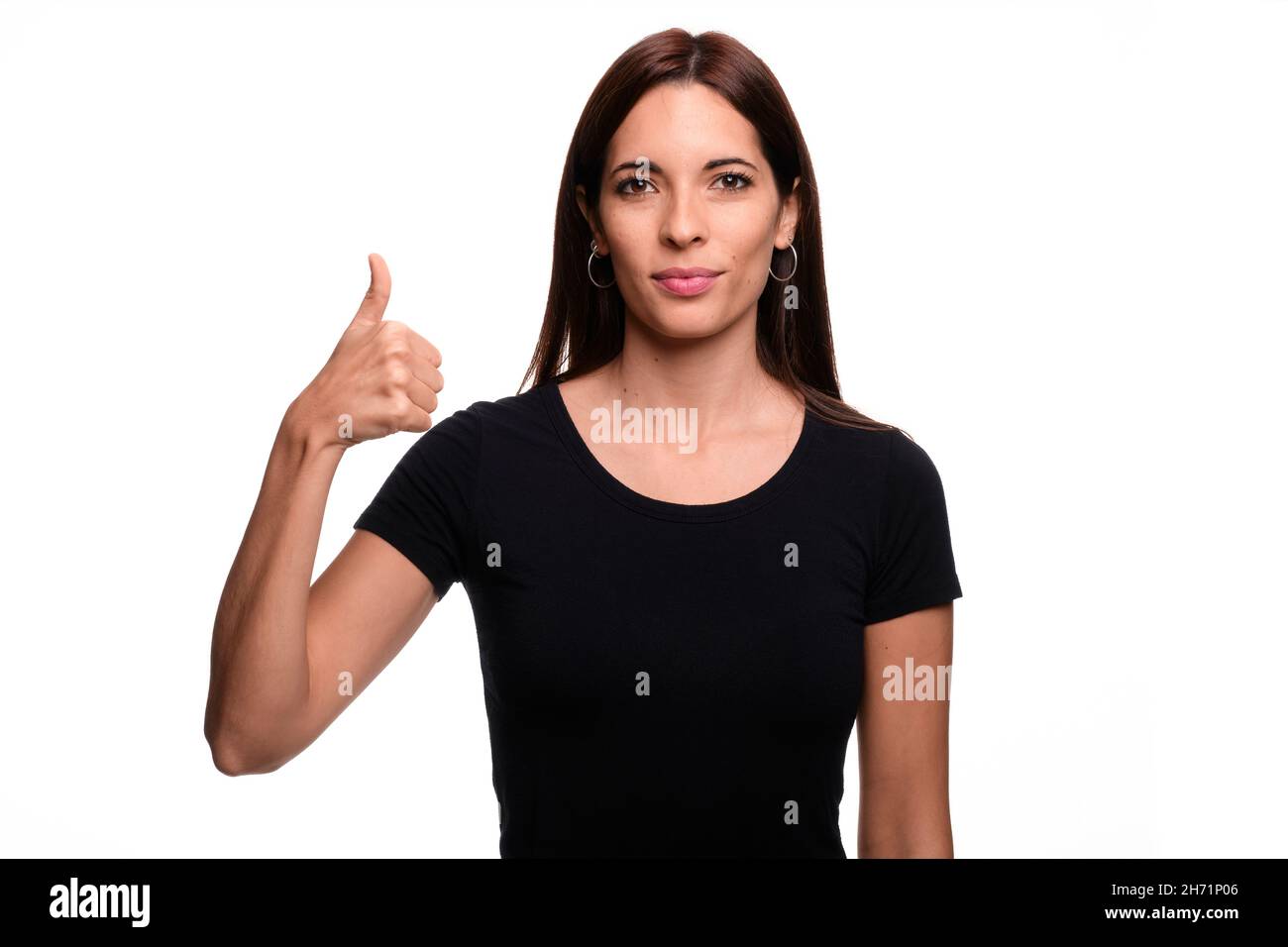 Isolated in white background brunette woman saying letter A in spanish ...
