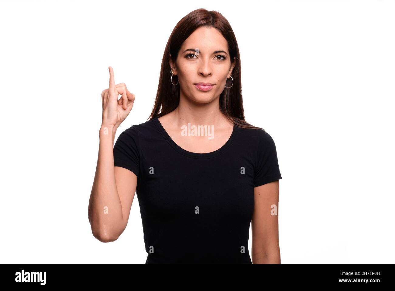 Isolated in white background brunette woman saying letter I in spanish ...
