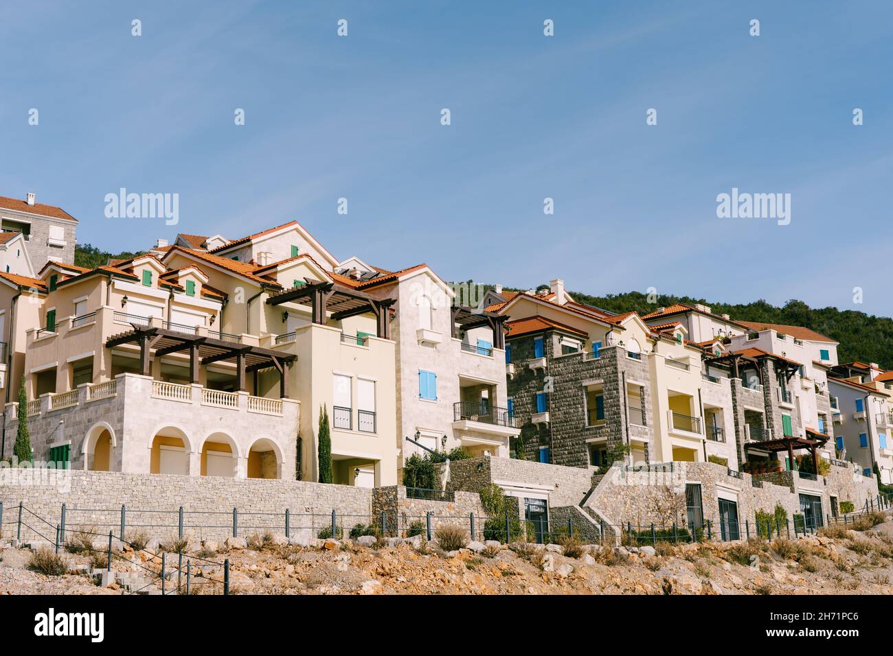 Colorful beautiful buildings of the village near the Lustica Bay Stock ...