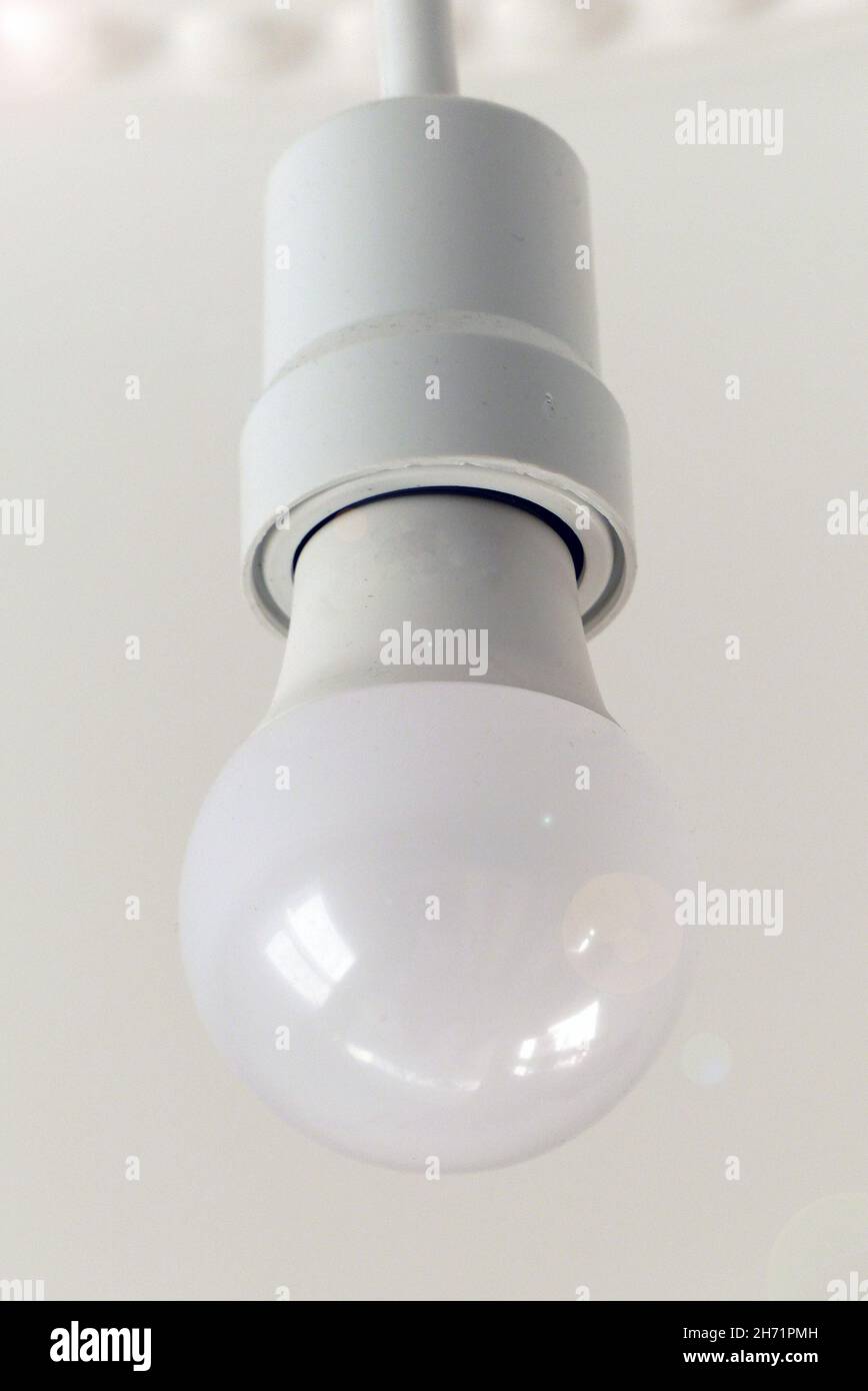 White led bulb hanging on the ceiling of the house Stock Photo - Alamy