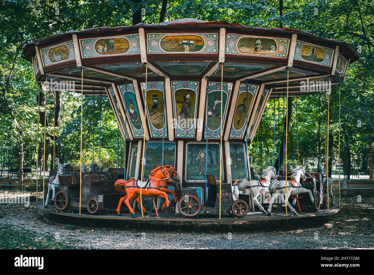 Abandoned horse carousel in a park Stock Photo - Alamy