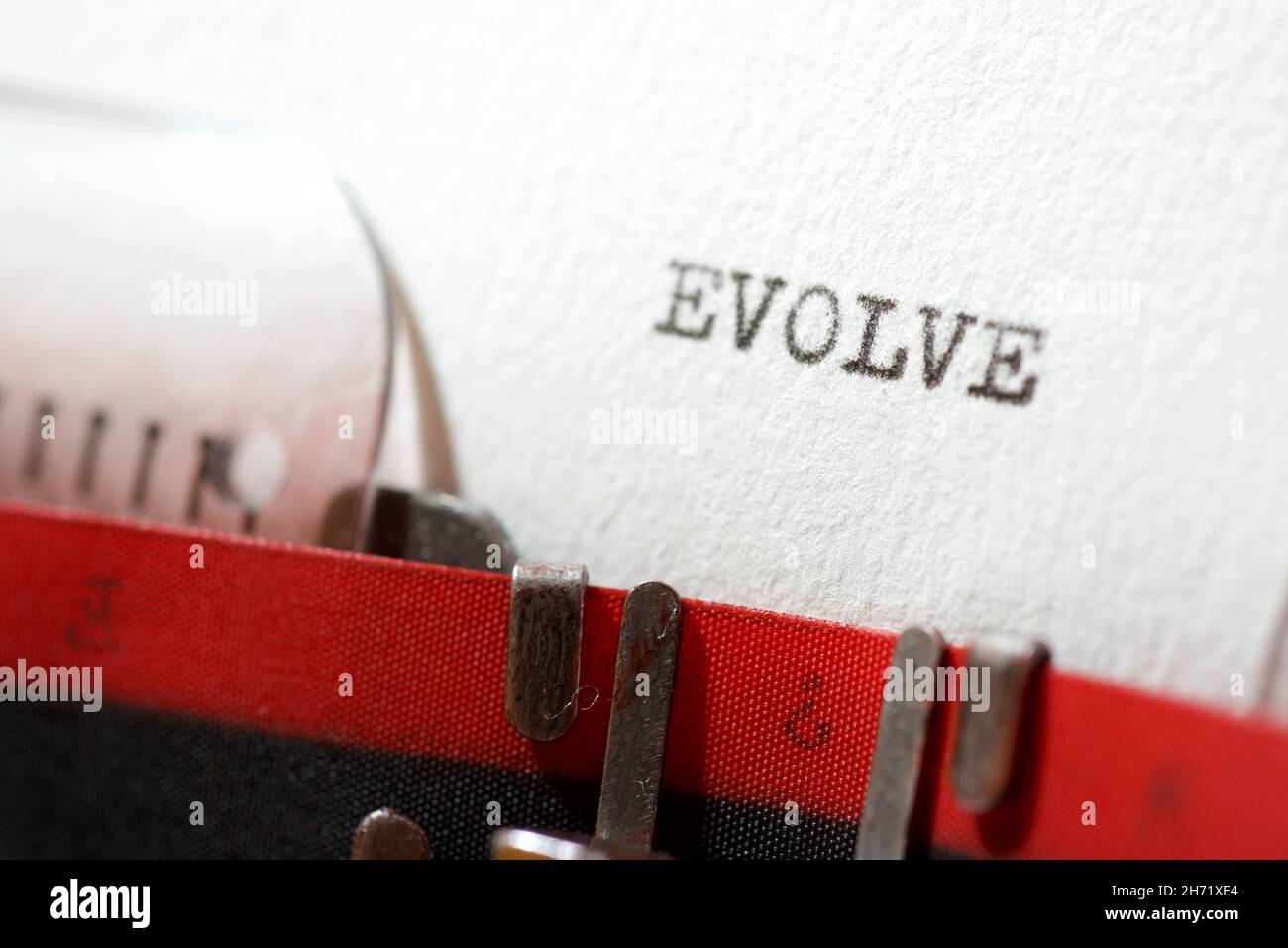 The word evolve written with a typewriter Stock Photo - Alamy