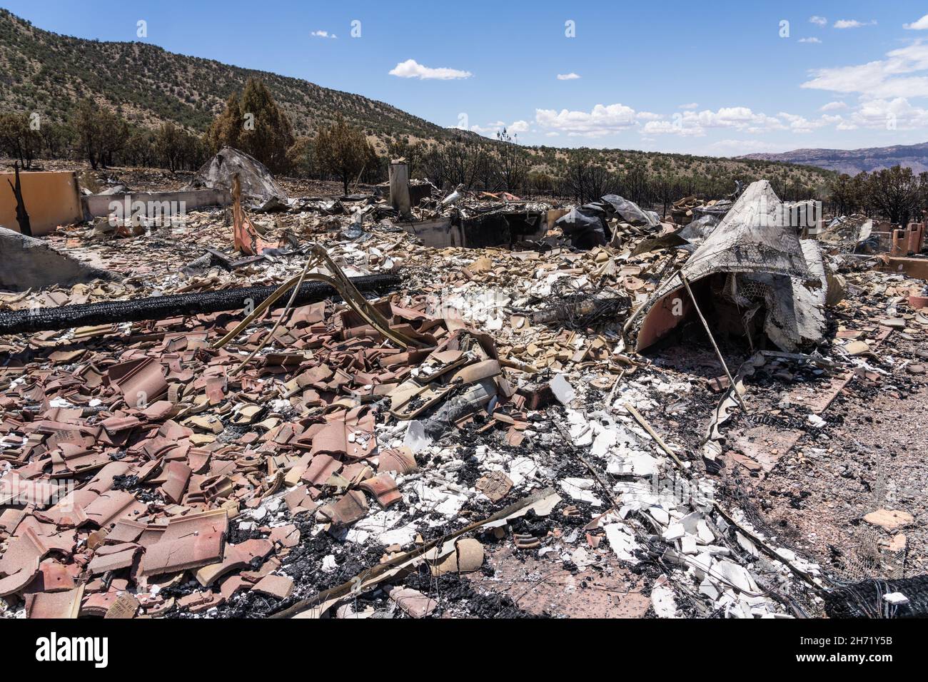 Burned out remains of a residence destroyed by the Pack Creek Wildfire ...