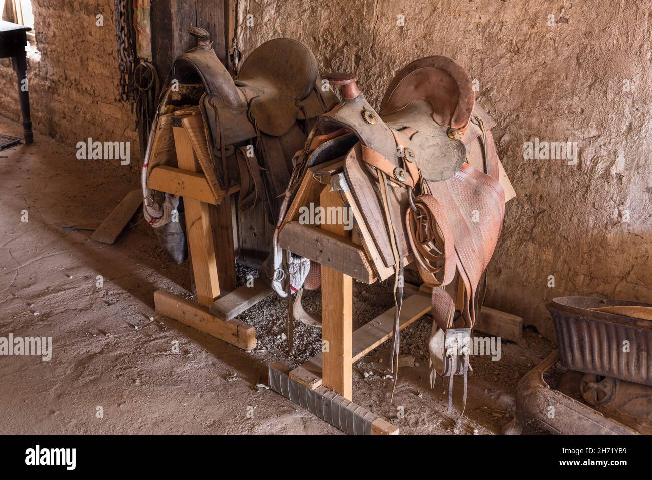 Two old leather cowboy saddles in the old ghost town of Shakespeare ...