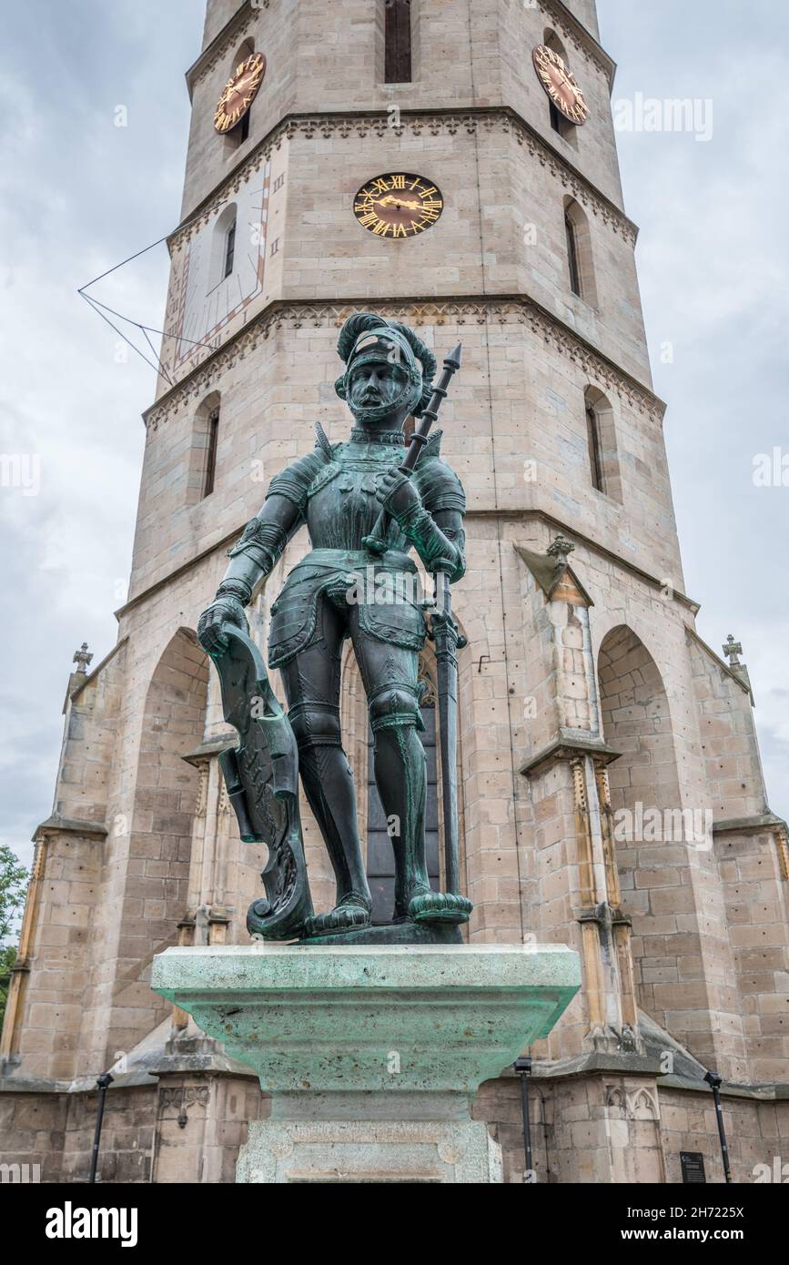 Massive tower of the town church in Balingen and the market fountain ...