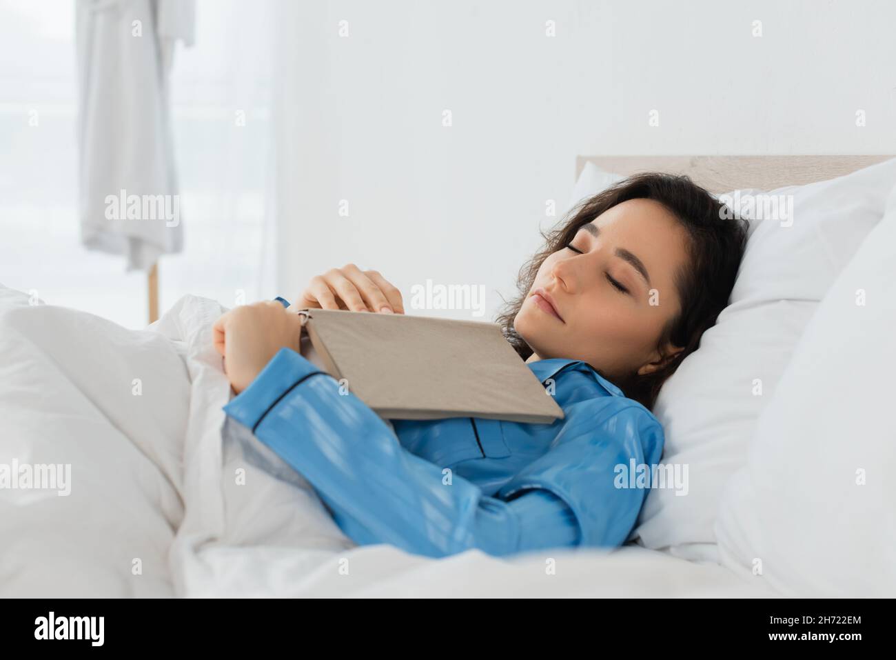 Beautiful woman book sleeping hi-res stock photography and images - Alamy