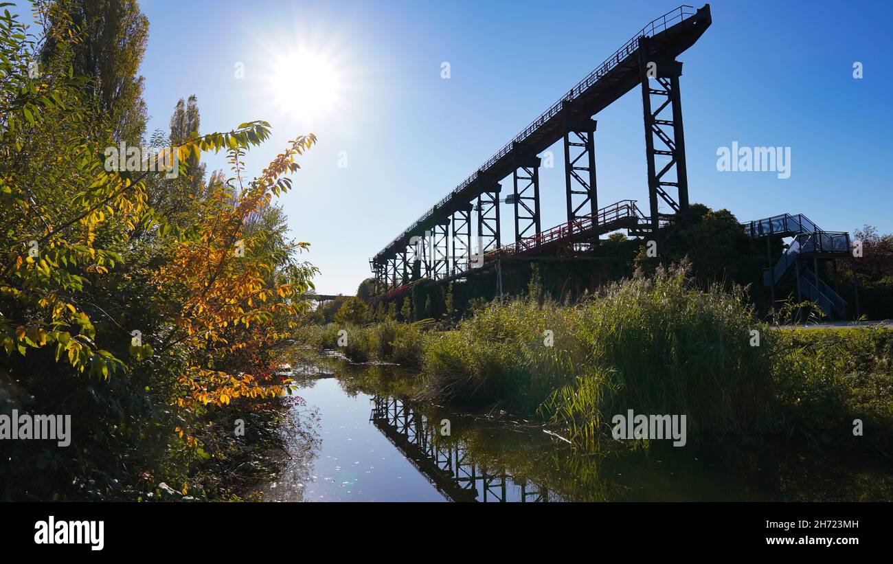 Old rusty industrial bridges in contrast with nature Stock Photo - Alamy