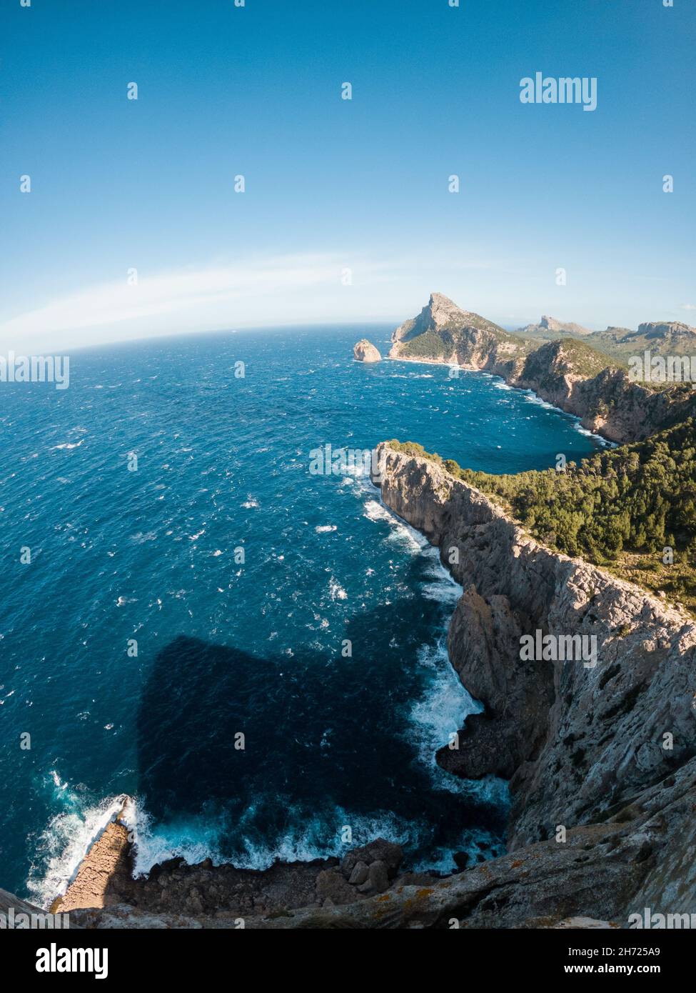 Beautiful view of the sea and high rocks on a sunny day in Mallorca ...