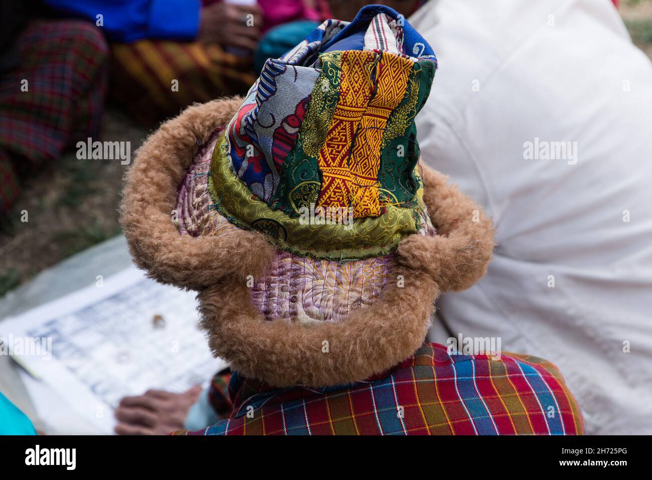 A Tibetan refugee in a Xamo Gyaise or golden thread hat in Thimphu ...