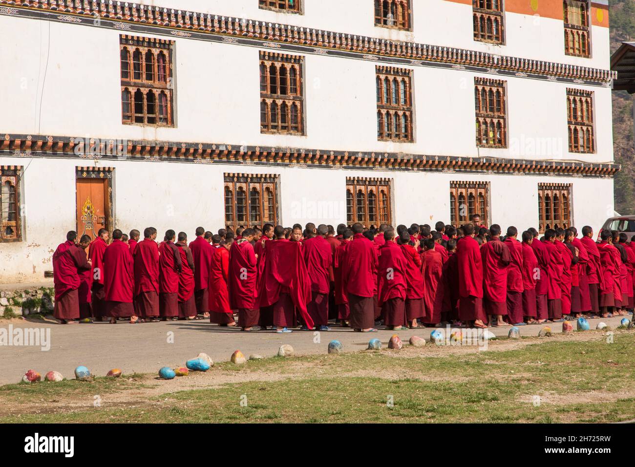 Young Buddhist monks line up at the Dechen Phodrang monastic school in ...