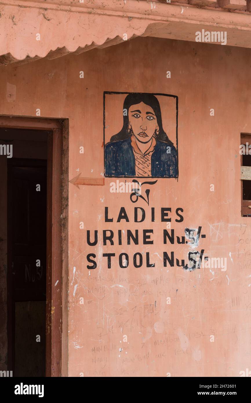 A sign on the outside of a public restroom at the farmers market in ...