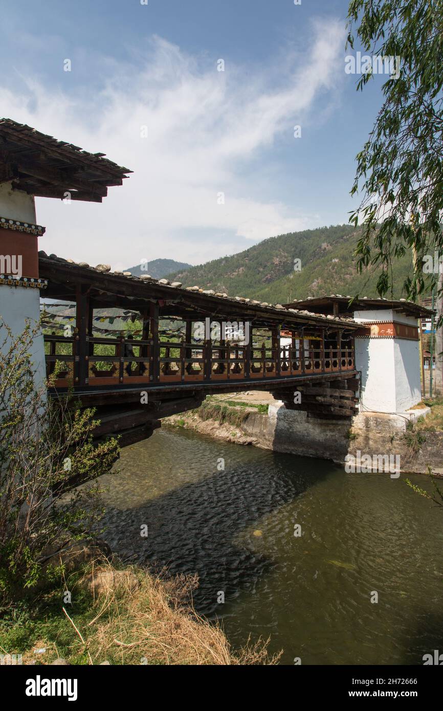 A bazam or cantilevered covered wooden bridge over the Thimphu or Wang ...
