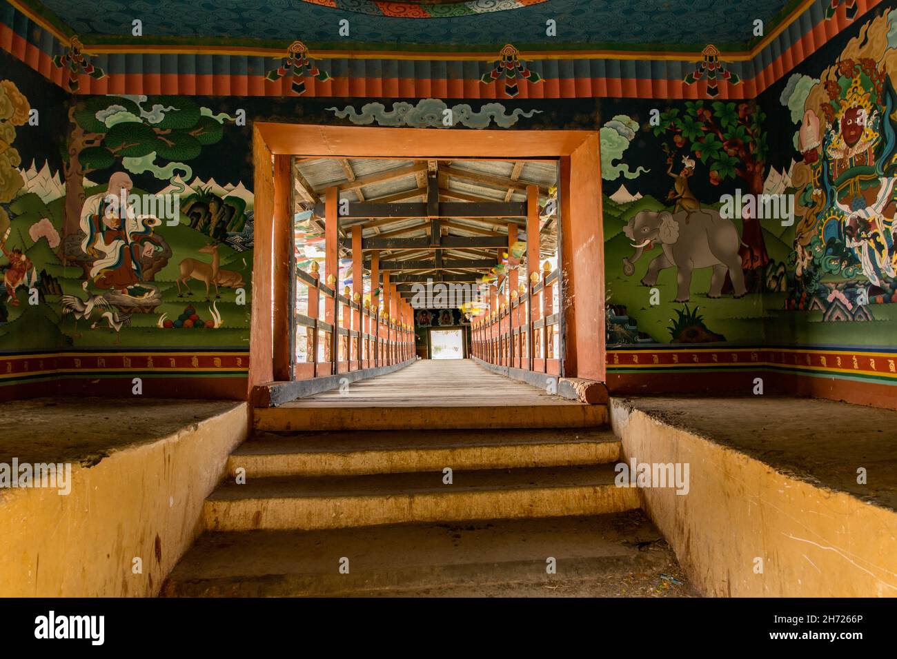 The inside entrance to a bazam or covered bridge painted with Buddhist ...