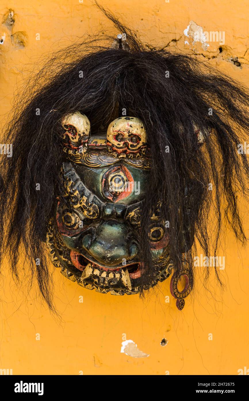 A symbolic Bhutanese wooden mask, locally called a bhaap, representing ...