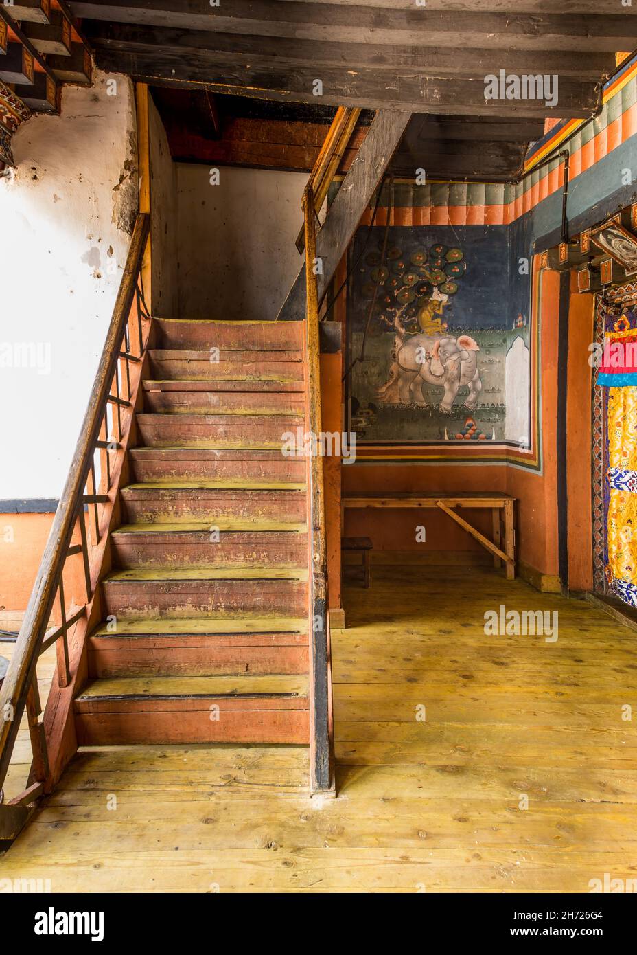 Buddhist religious art and a stairway in the Dechen Phodrang Monastery ...