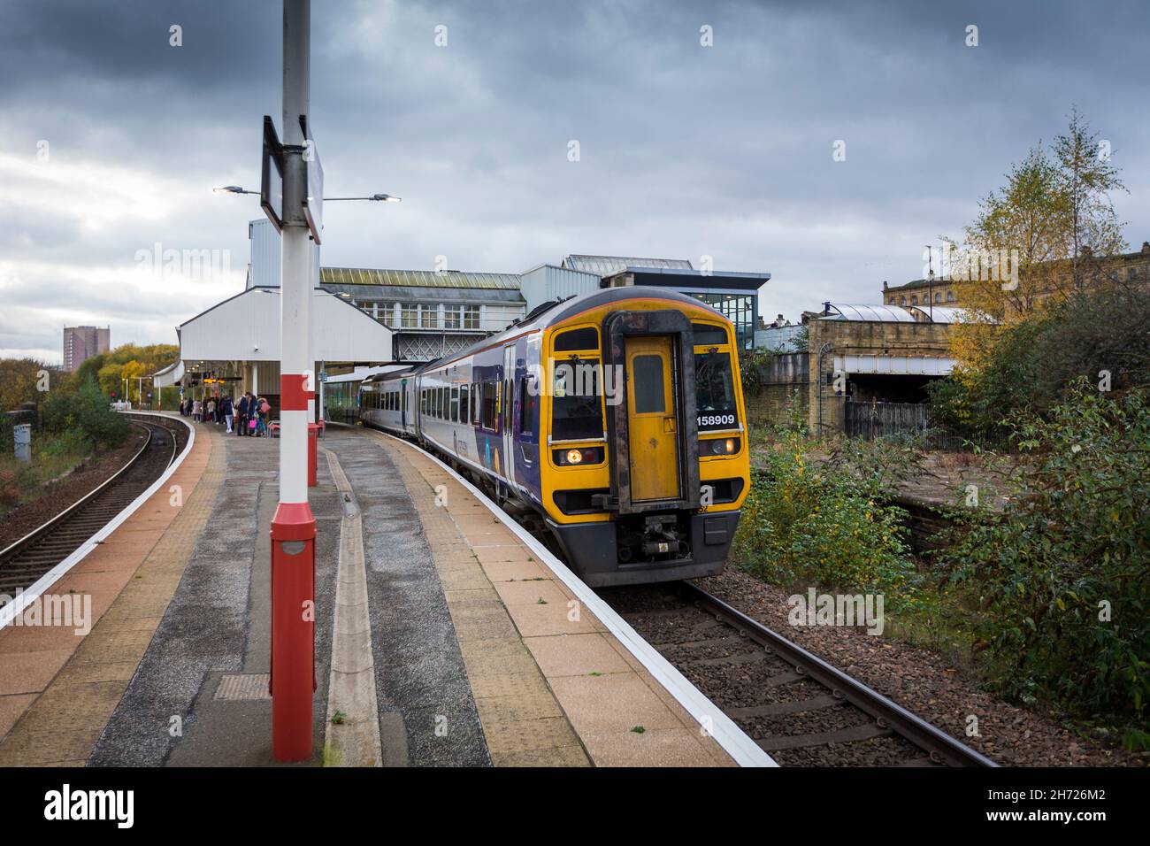Northern Rail trains pass through the West Yorkshire railway station of ...