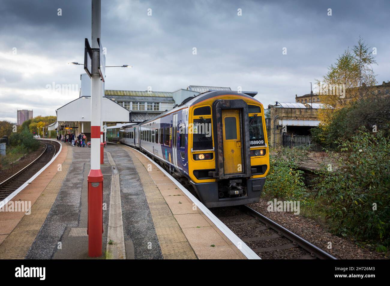Northern Rail trains pass through the West Yorkshire railway station of ...