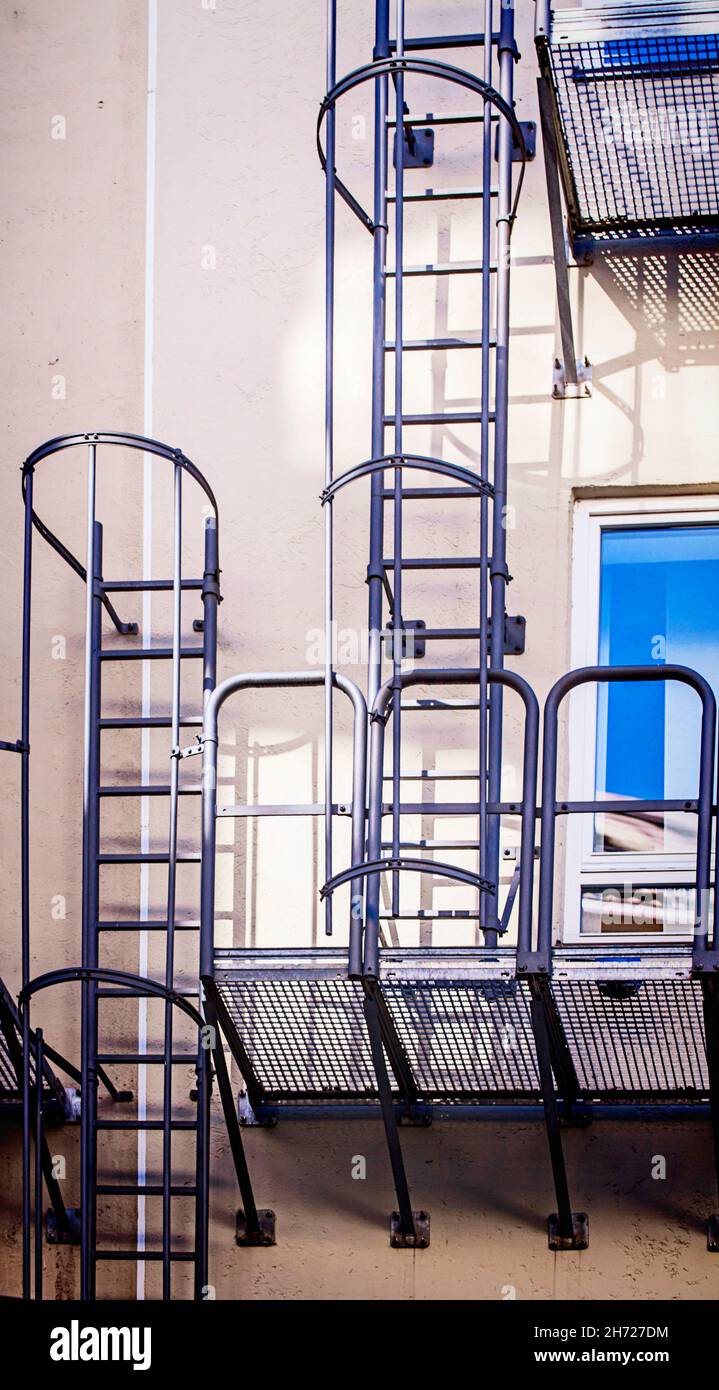 Utility ladder and fire escape stairs outside a modern apartment ...