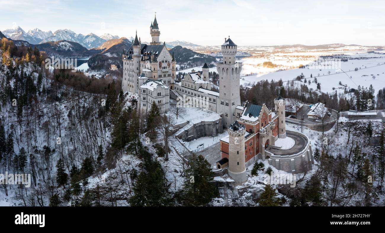 Scenic shot of the Neuschwanstein Castle in Germany surrounded by snowy ...