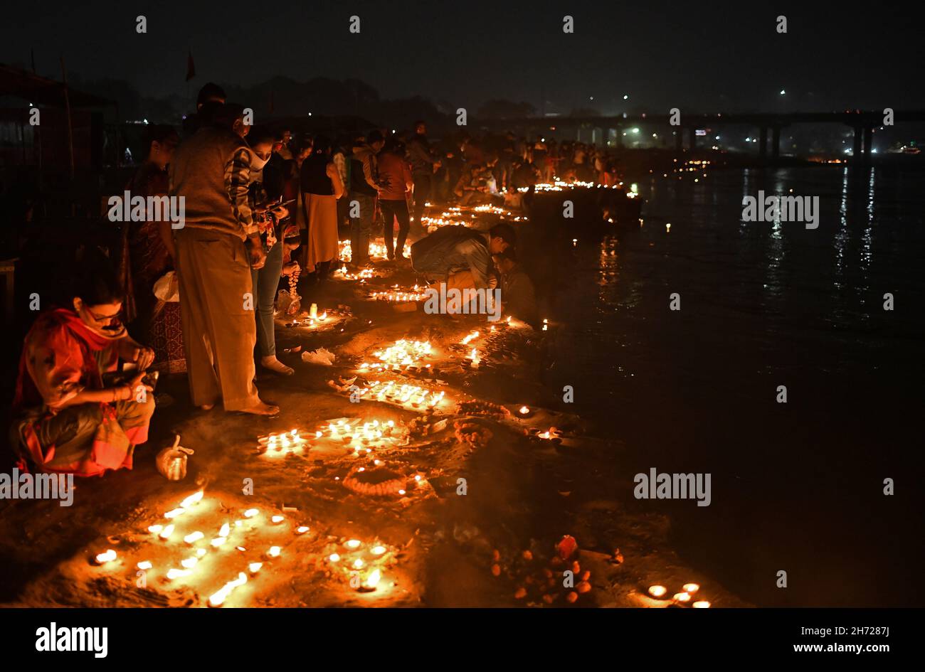 Hindu devotees light earthen lamps hi-res stock photography and images ...