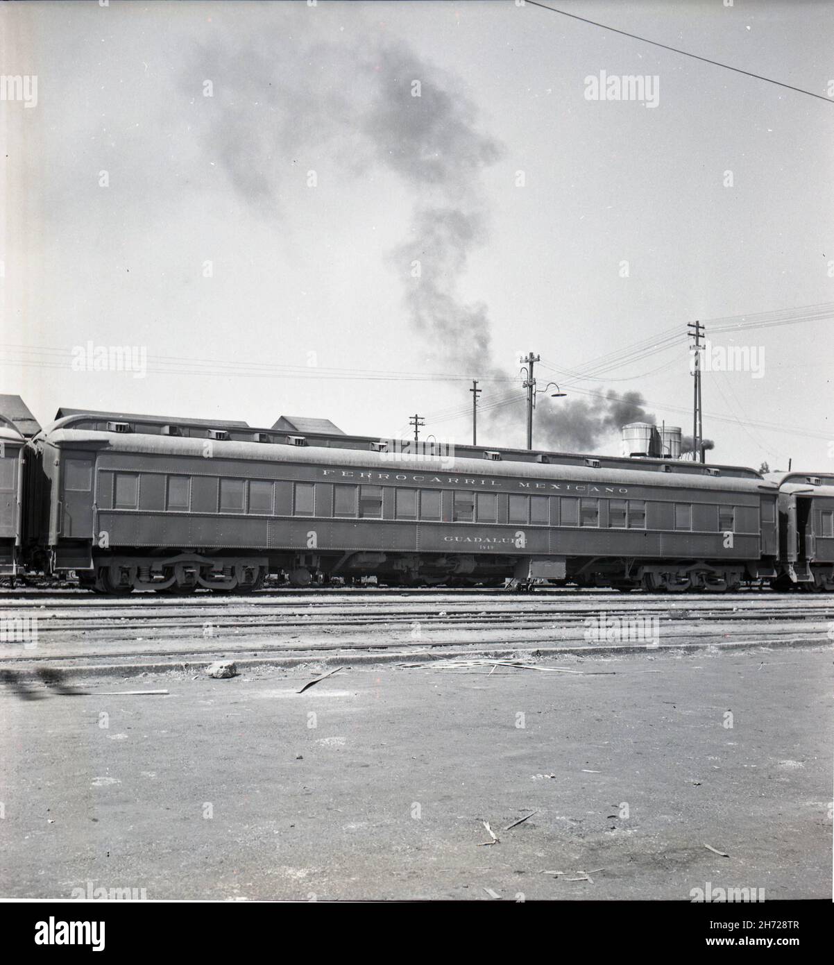 Grayscale of a steamed locomotive in 19th-century railroad Stock Photo ...