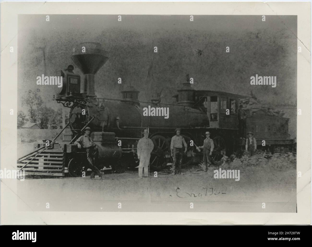 Portrait grayscale shot of a steamed locomotive in 19th-century ...